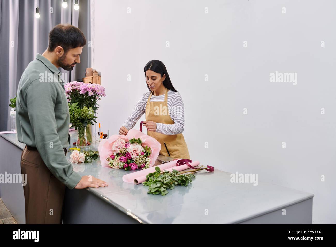 A talented florist collaborates with a male client to design exquisite ...
