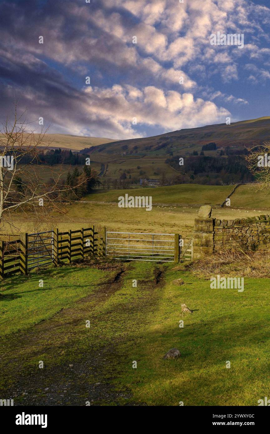 Captivating countryside landscape with a gate leading to rolling hills ...