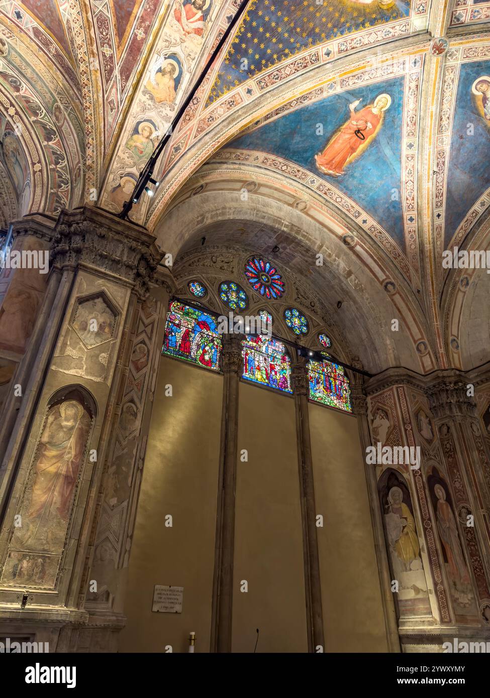 Medieval frescoes and stained glass windows in the Orsanmichele Church ...