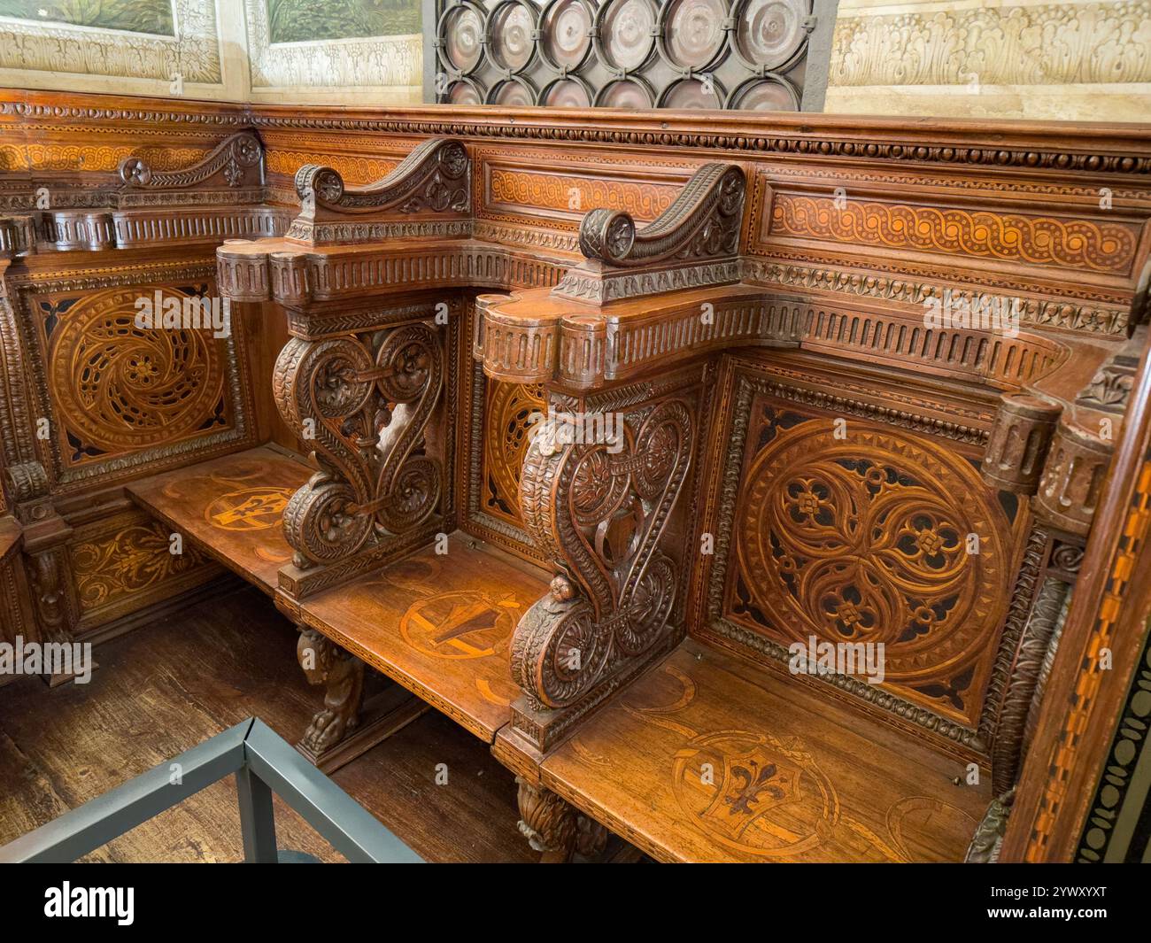 Carved wooden stalls with inlaid wood designs in the Magi Chapel in the ...