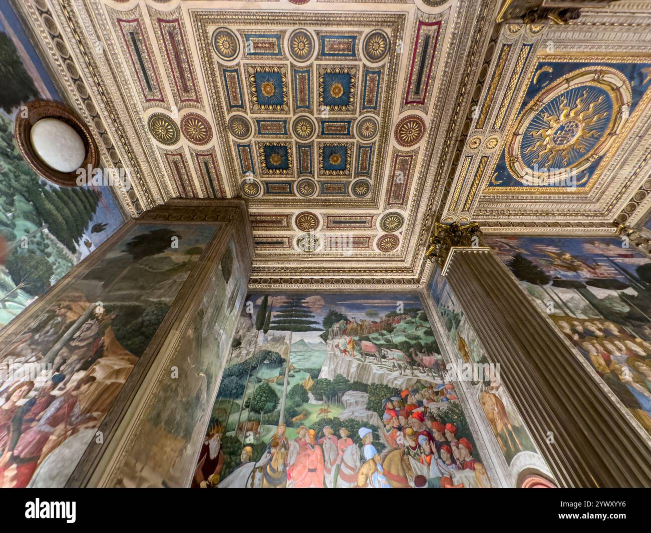 Ornate carved and gilded ceiling in the Magi Chapel in the Palazzo Medici Riccardi in Florence ...