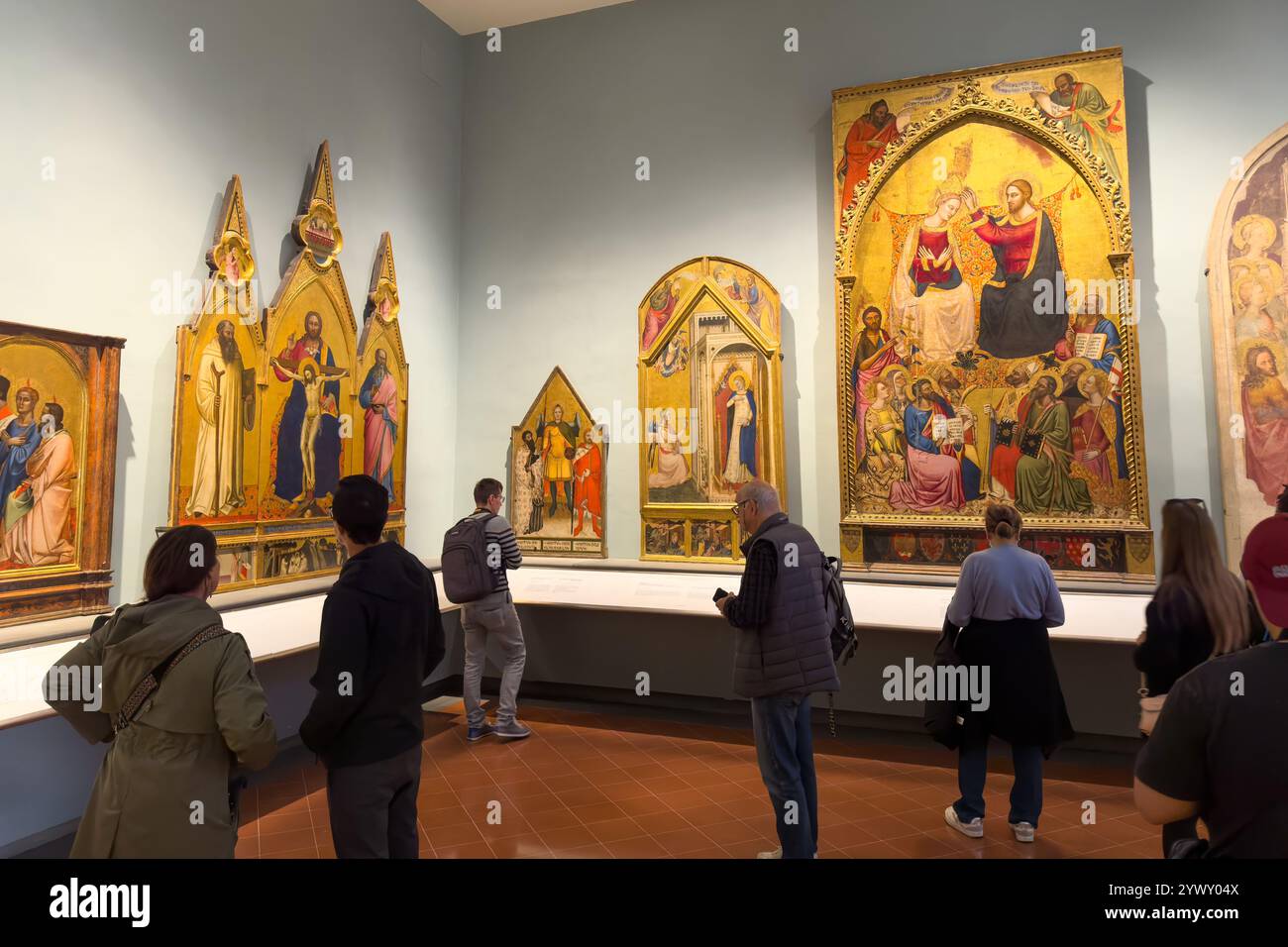 Visitors viewing Renaissance paintings in an exhibit hall in the ...