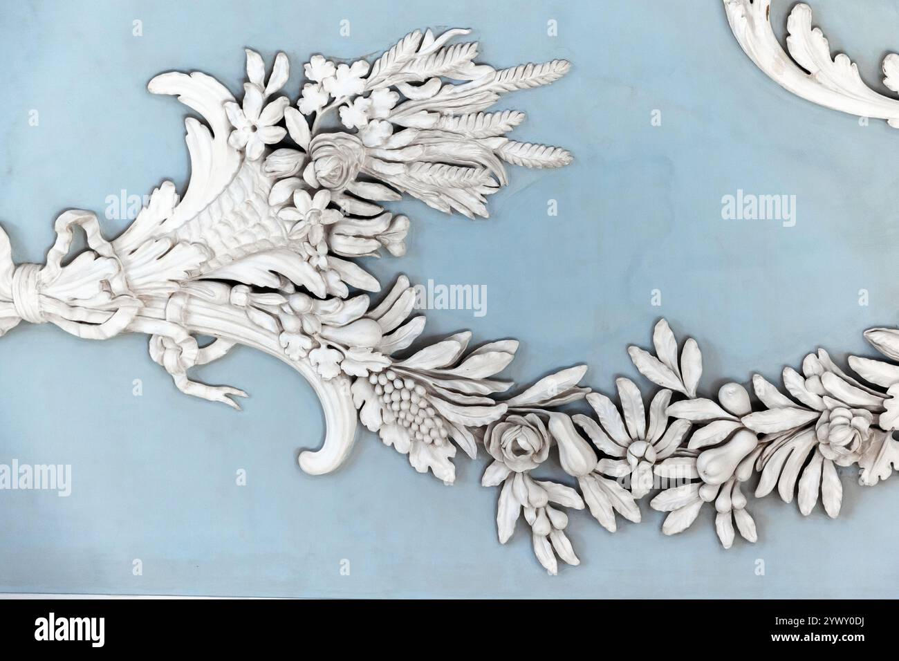 White bas-relief over blue ceiling backdrop. Classic moulding, vintage ...