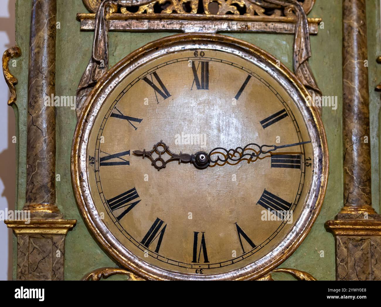Old wall clock with roman numerals Stock Photo - Alamy