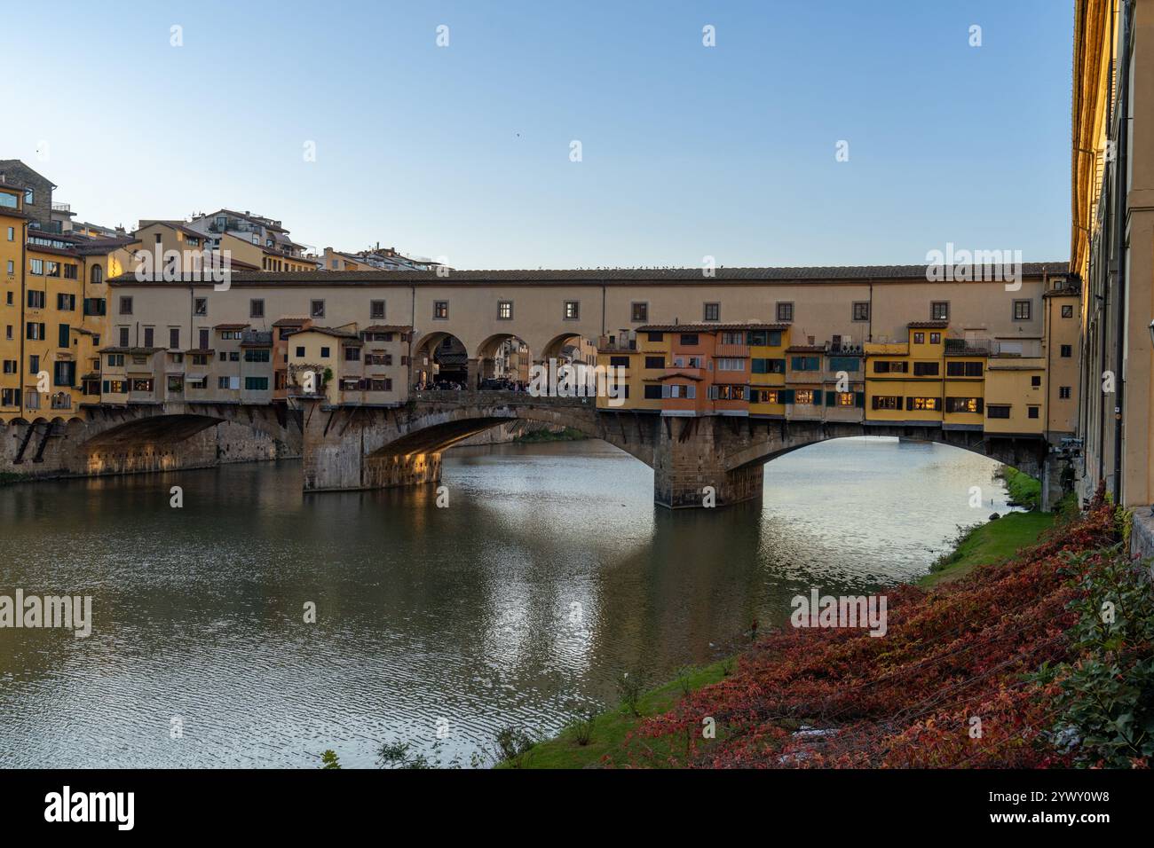 The Ponte Vecchio, a medieval stone arch bridge over the Arno in ...