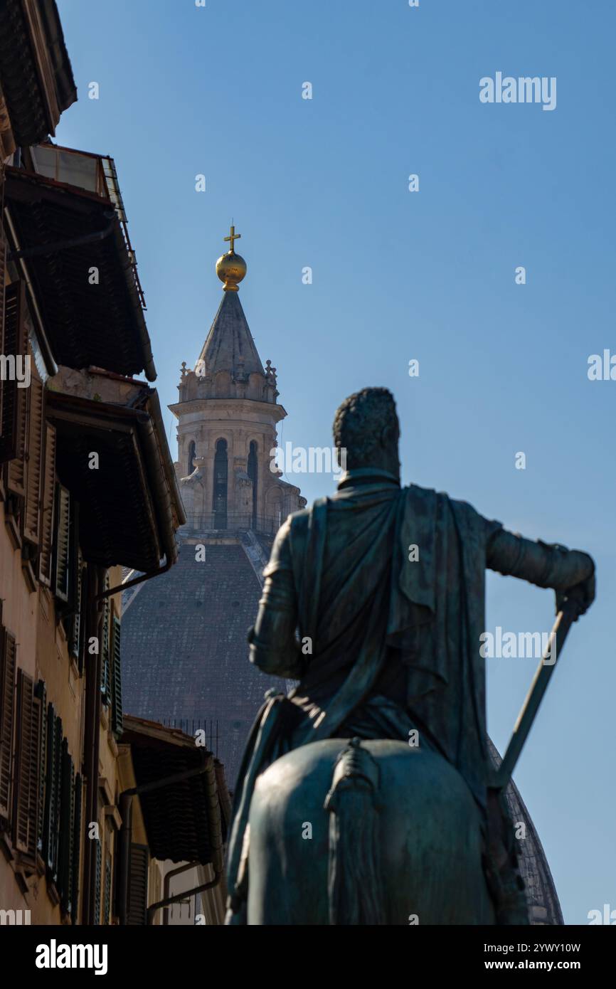 The statue of Grand Duke Fernando de Medici facing the dome of the ...