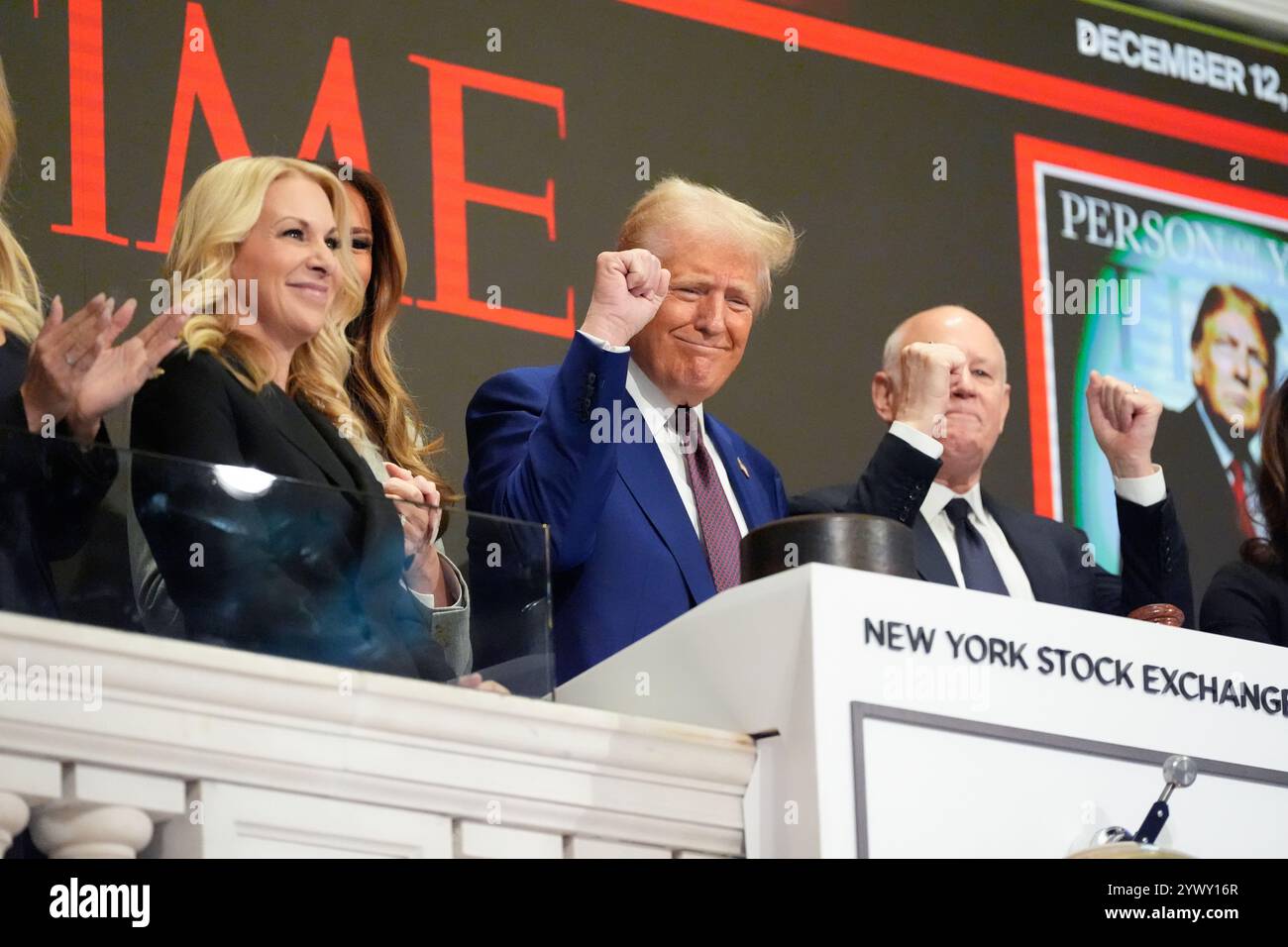 President-elect Donald Trump gestures after ringing the opening bell at ...