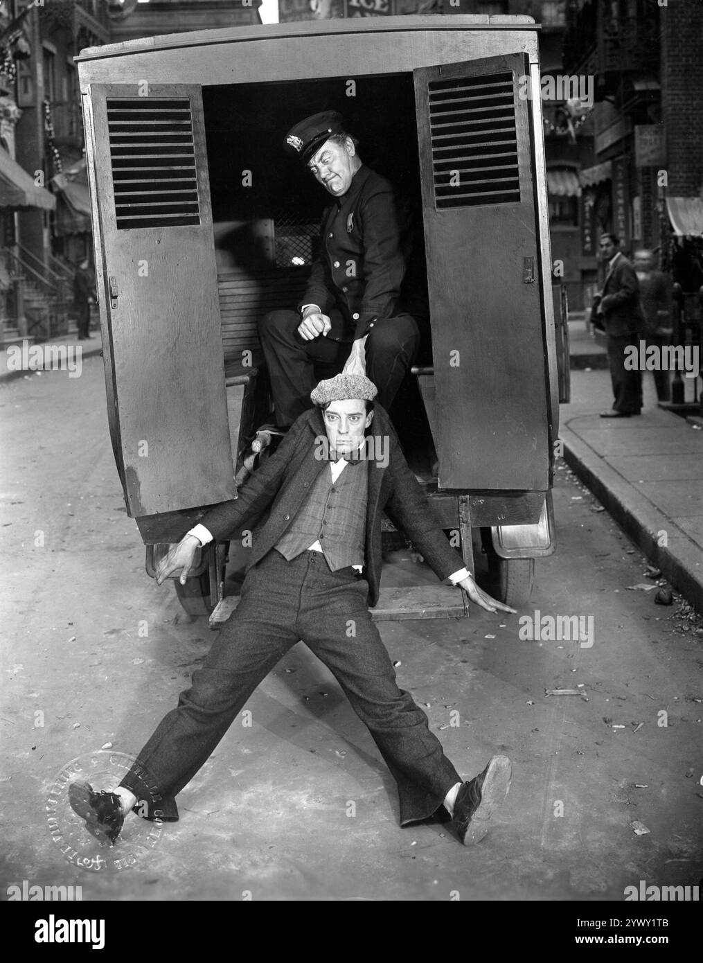 Actor and film pioneer Buster Keaton dragged by a police officer in The ...