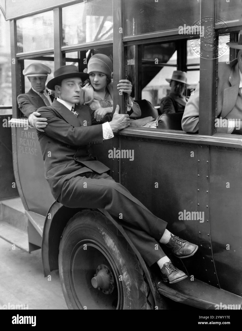 Actor and film pioneer Buster Keaton riding a bus in film The Cameraman ...