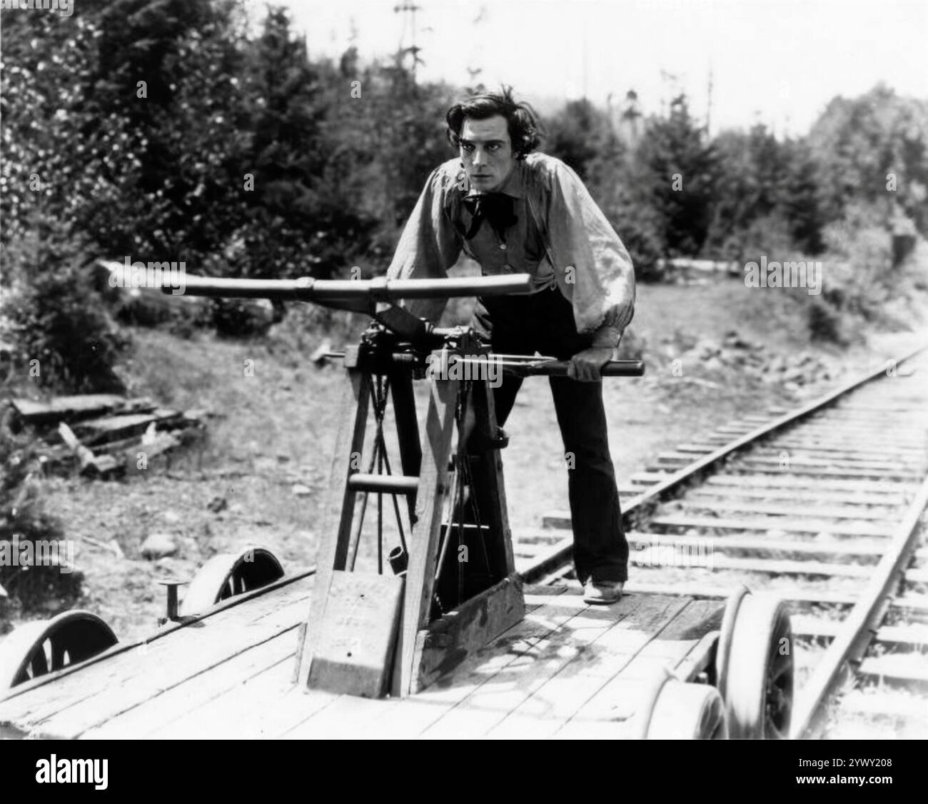 Buster Keaton drives a two-man, railroad handcar in The General, c 1925 ...
