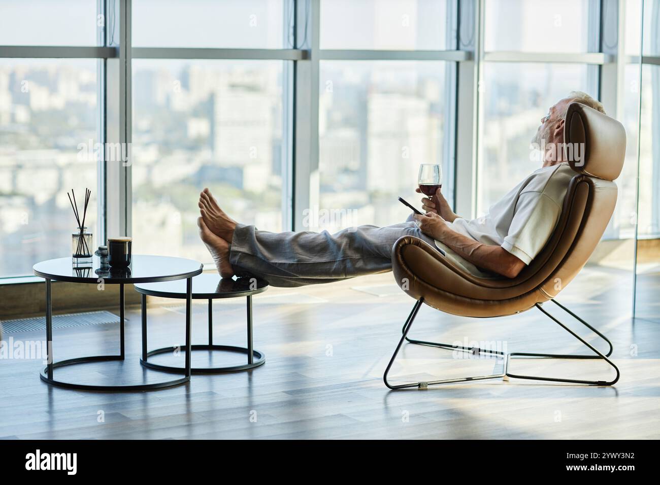 Side view of laid back successful mature man relaxing in comfy armchair ...