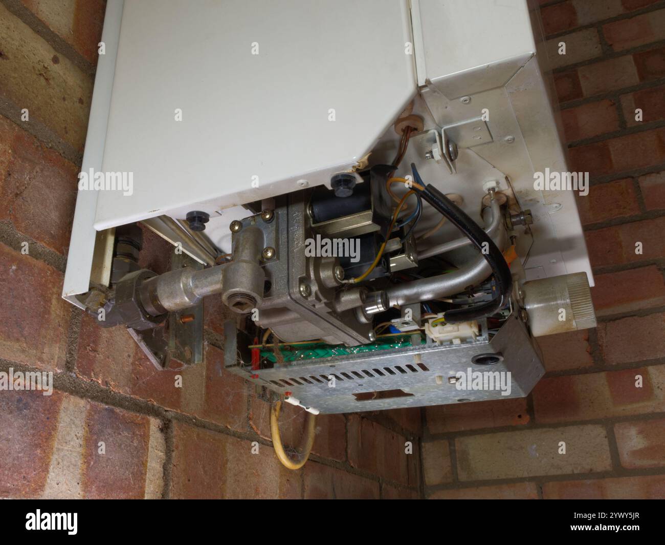 Closeup of the underside of a traditional gas boiler for domestic ...