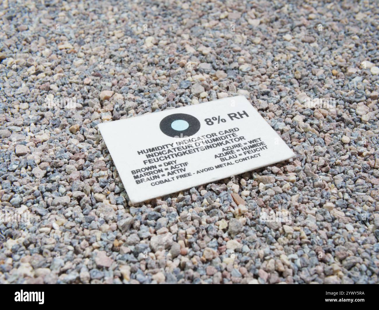 A humidity indicator card on top of chemically inert, activated clay ...