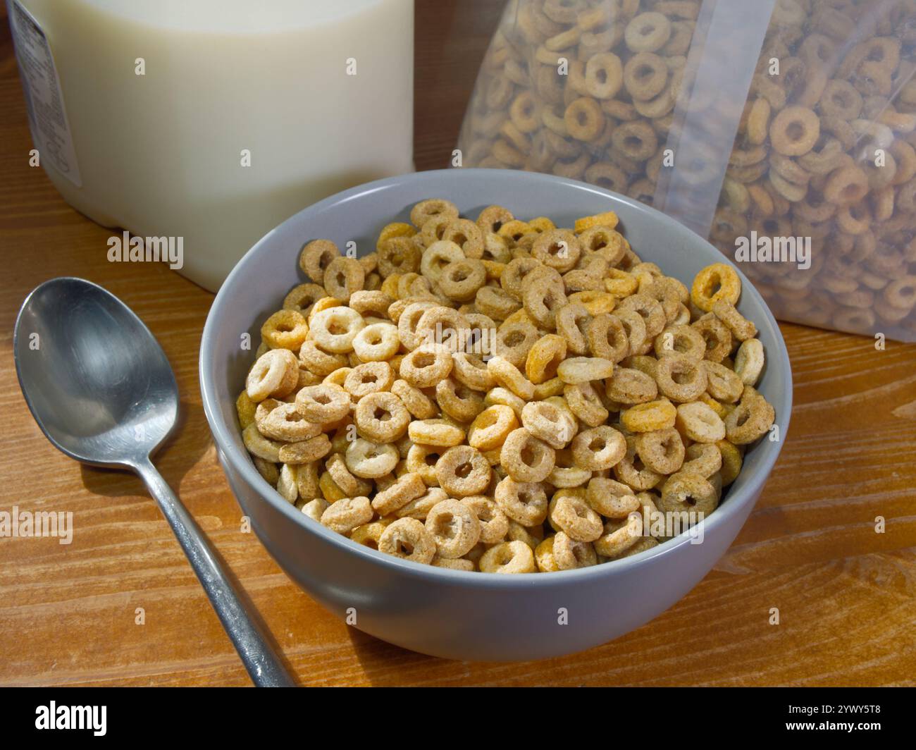Closeup of multigrain hoops dry cereal in a packet and a breakfast bowl ...