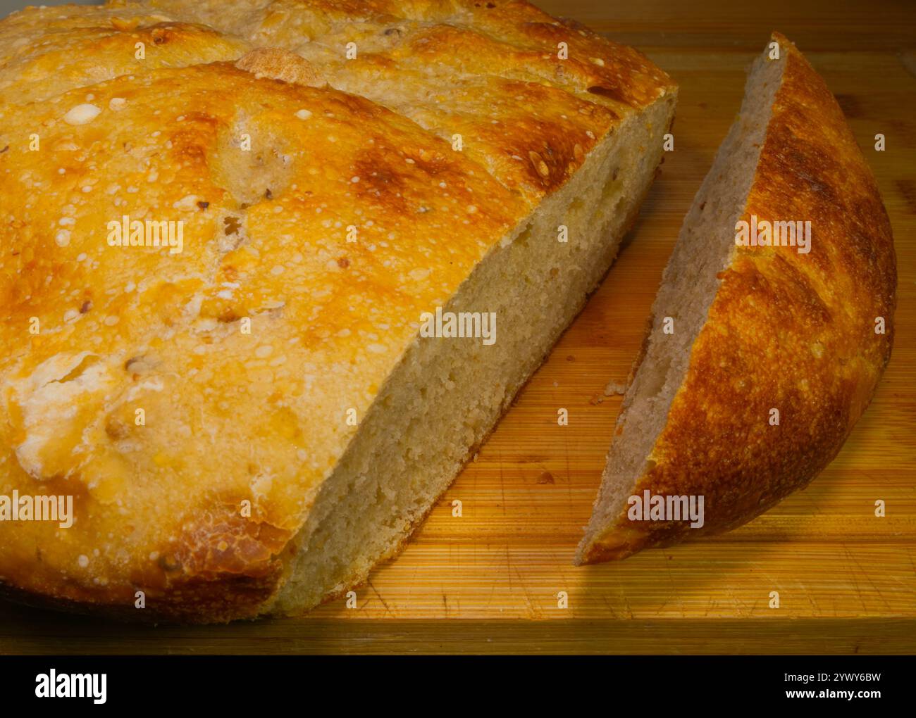 Closeup of a loaf of freshly baked, crusty, sourdough bread, with the ...
