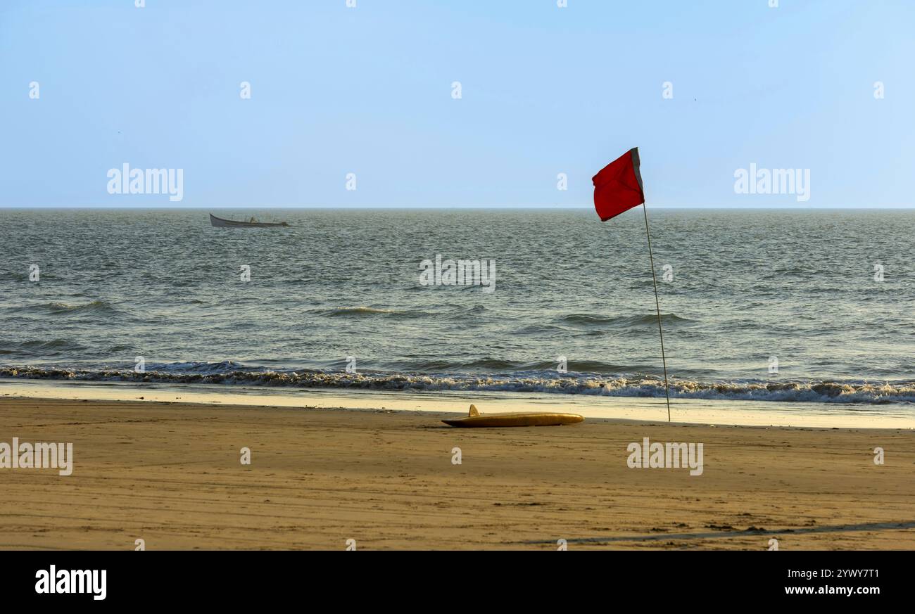 Red flag on beach in Goa state in India Stock Photo - Alamy