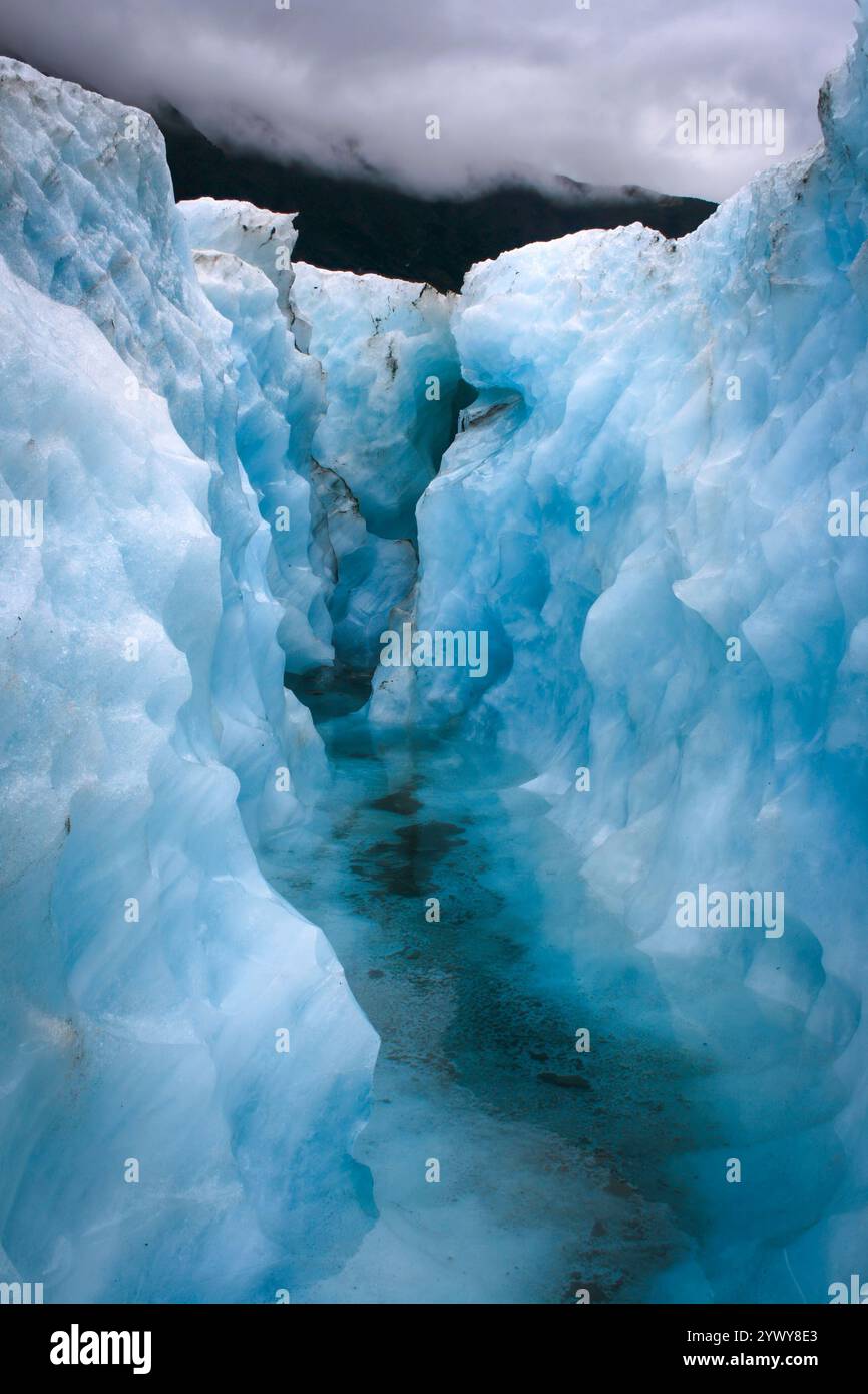 Blue Ice crevasse whilst hiking on Fox Glacier in New Zealand - huge ...