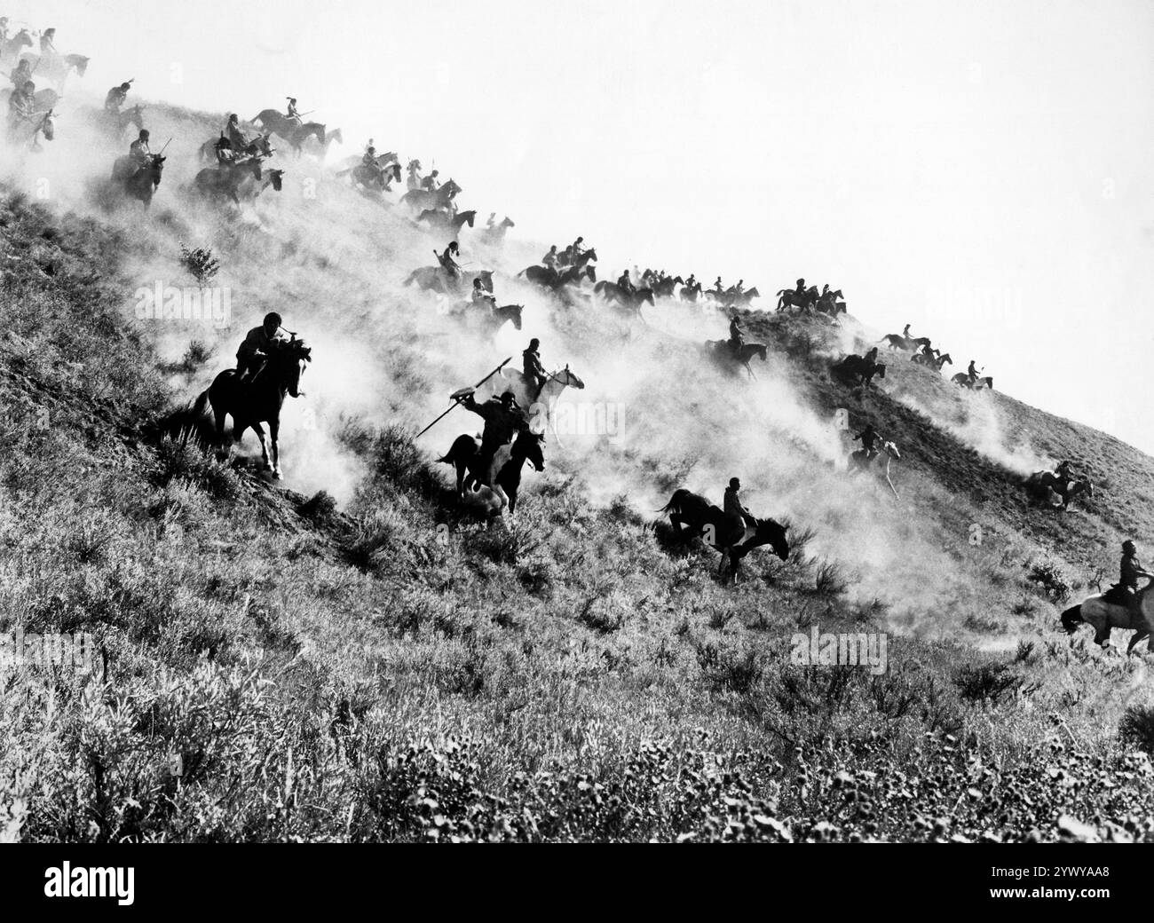 Native American fighters charging down hillside on horseback, on-set of ...