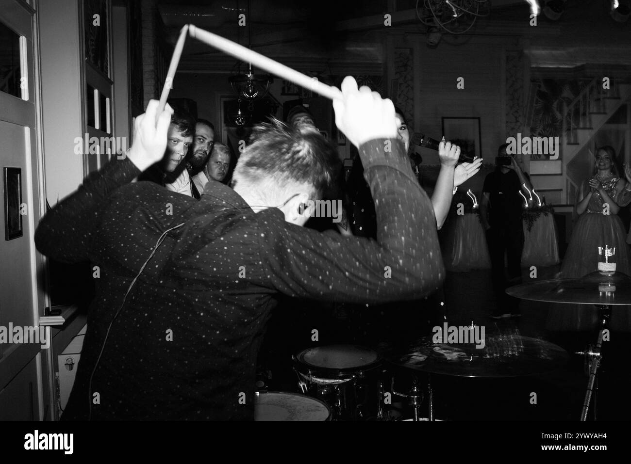 guy musician plays the drum at a concert in stage lighting Stock Photo ...
