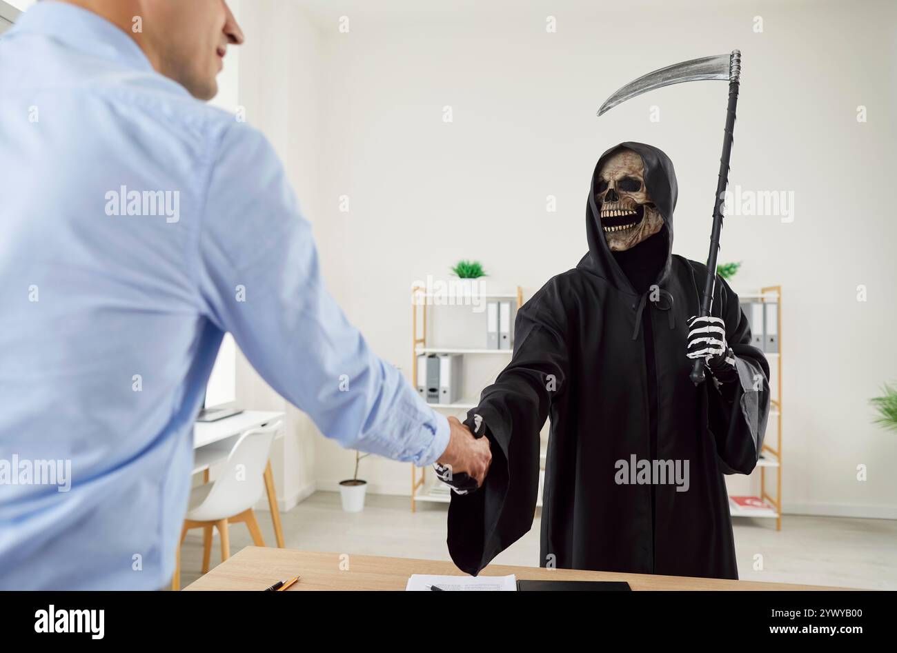Business man shaking hands making deal with devil in Halloween grim ...