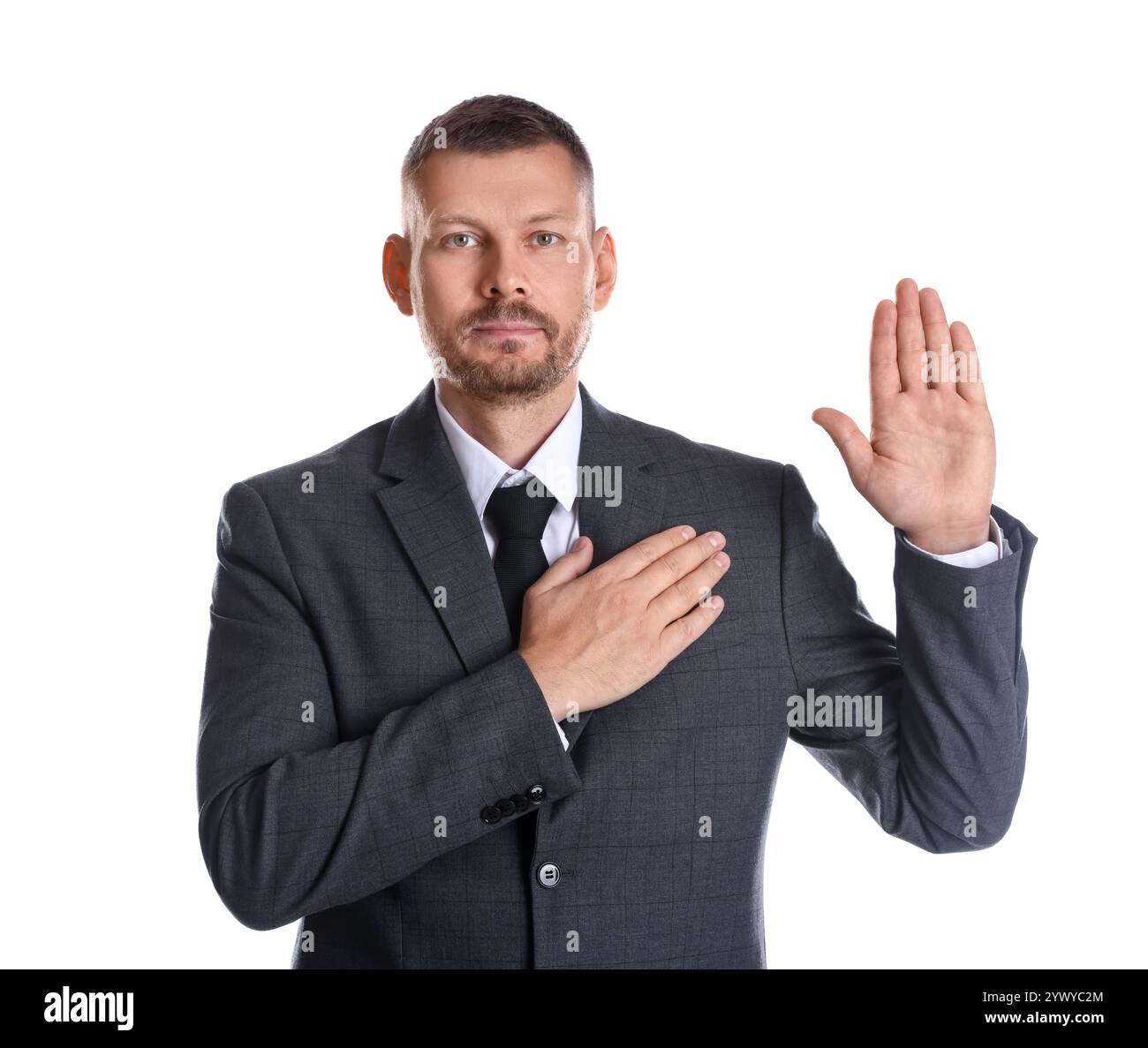 Man making promise with raised hand on white background. Oath gesture ...