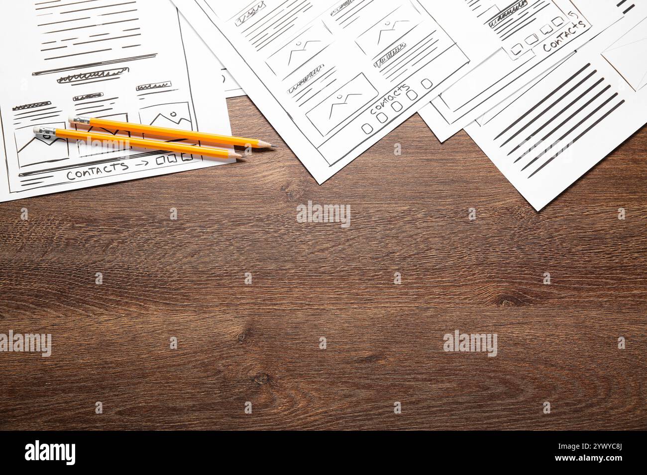 Developing UI design. Sketches of website wireframes and pencils on ...
