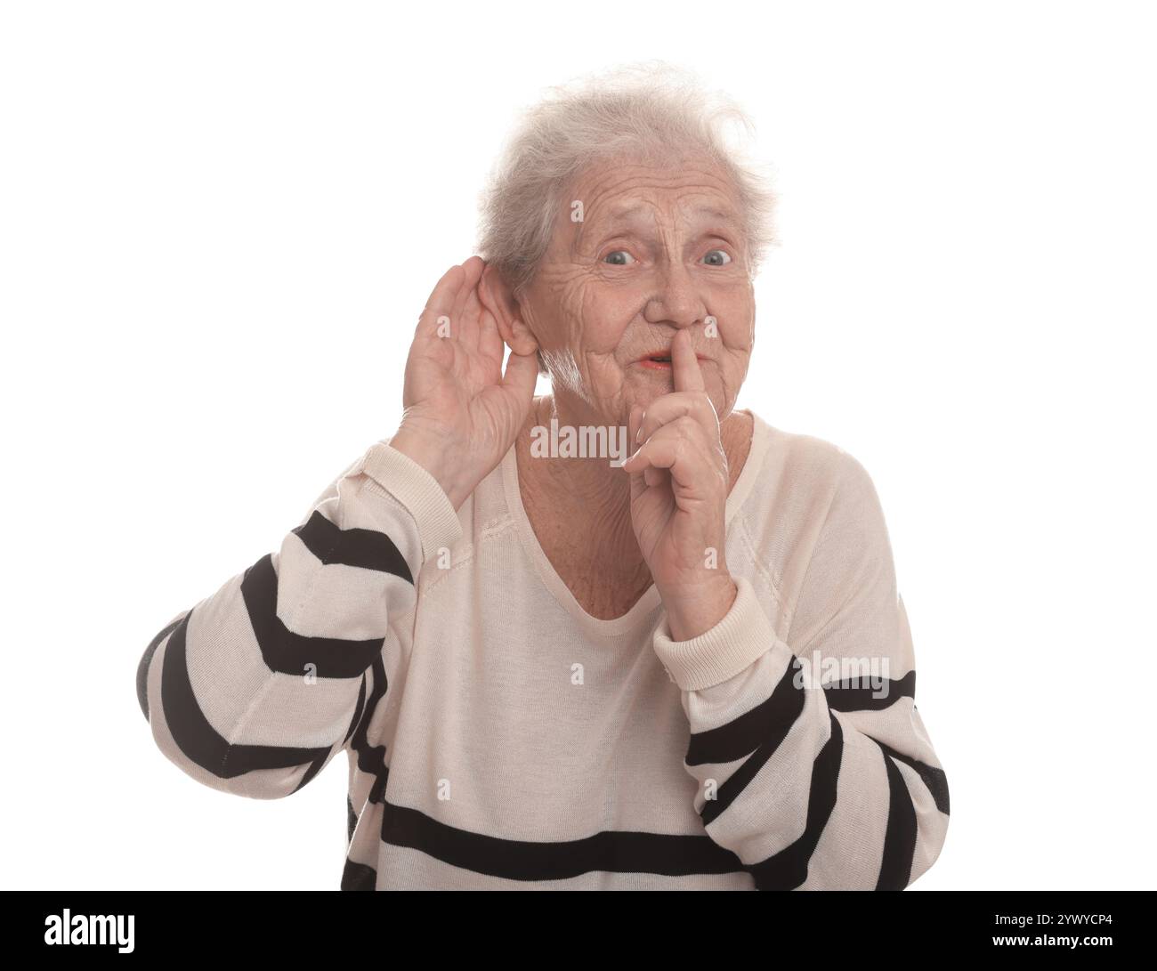 Senior woman showing hand to ear gesture on white background Stock ...