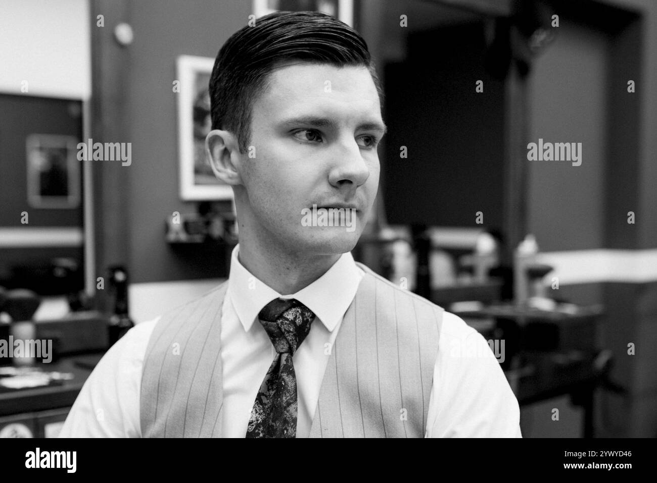 bearded man cutting his beard in the barbershop at the master Stock ...