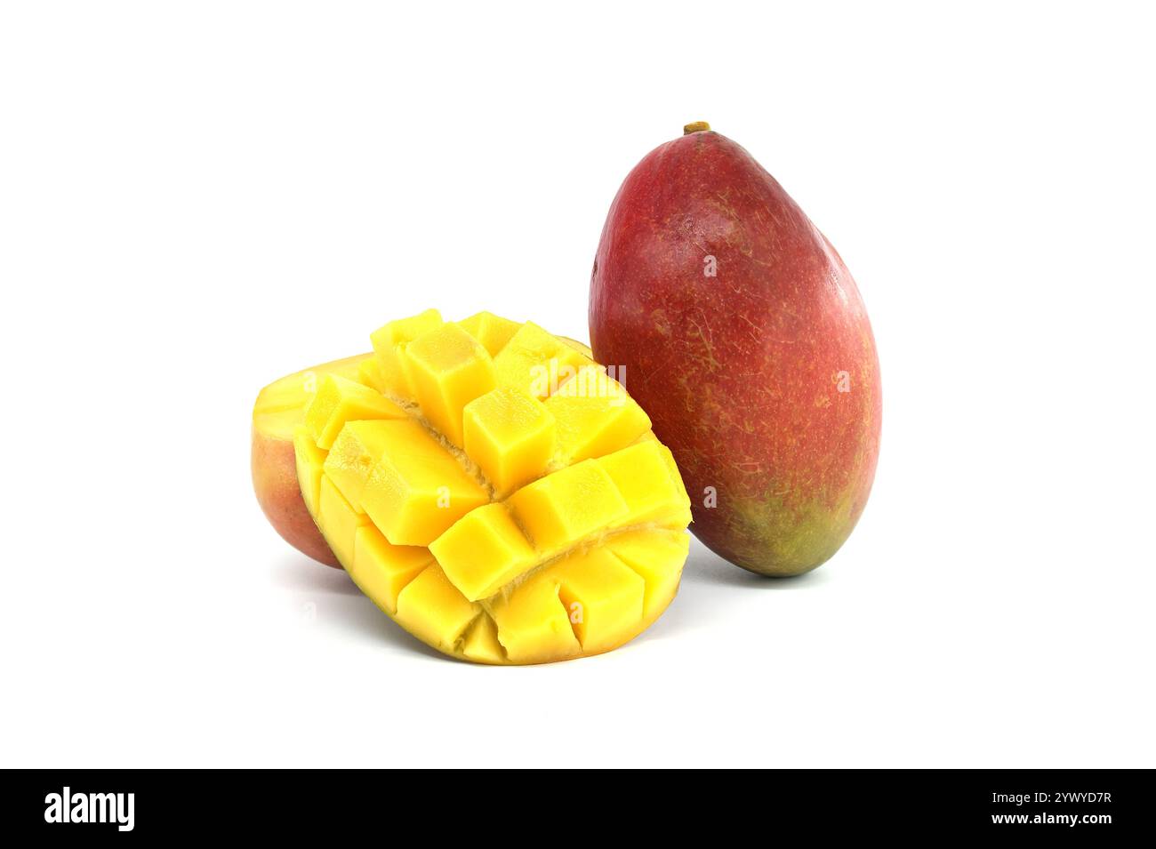 Juicy ripe mango shown whole and sliced into cubes, highlighting the ...