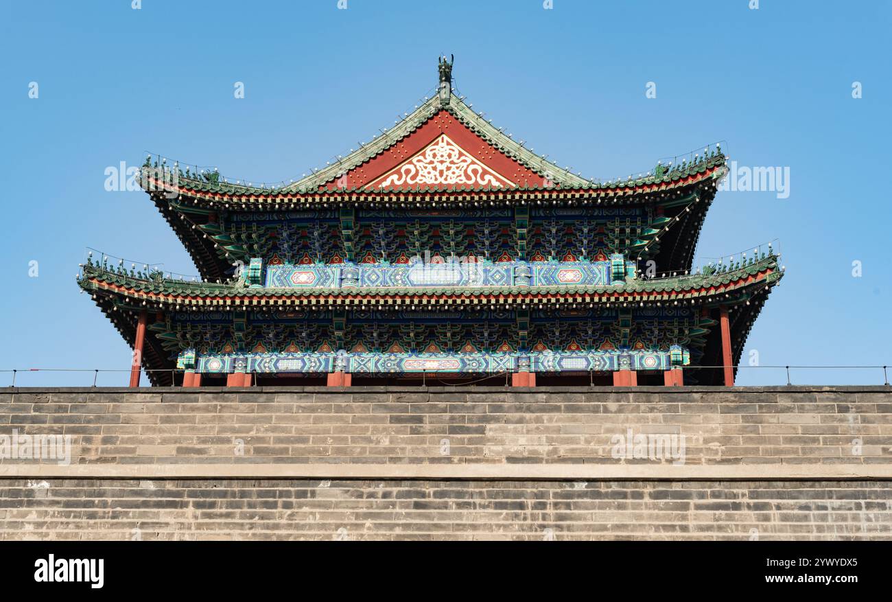 Ornate rooftop of chinese building rising above fortified wall Stock ...