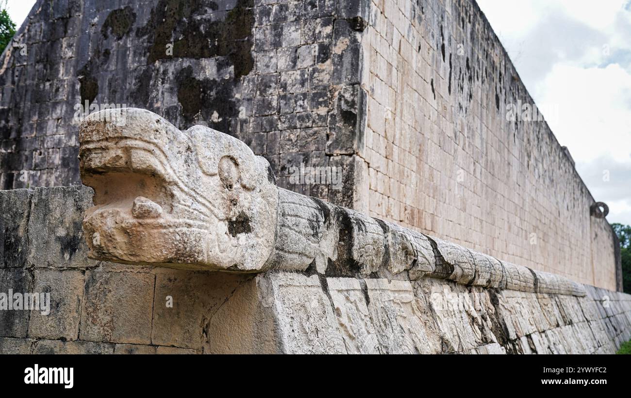 Kukulcan Serpent head sculpture close up with view of the east wall ...