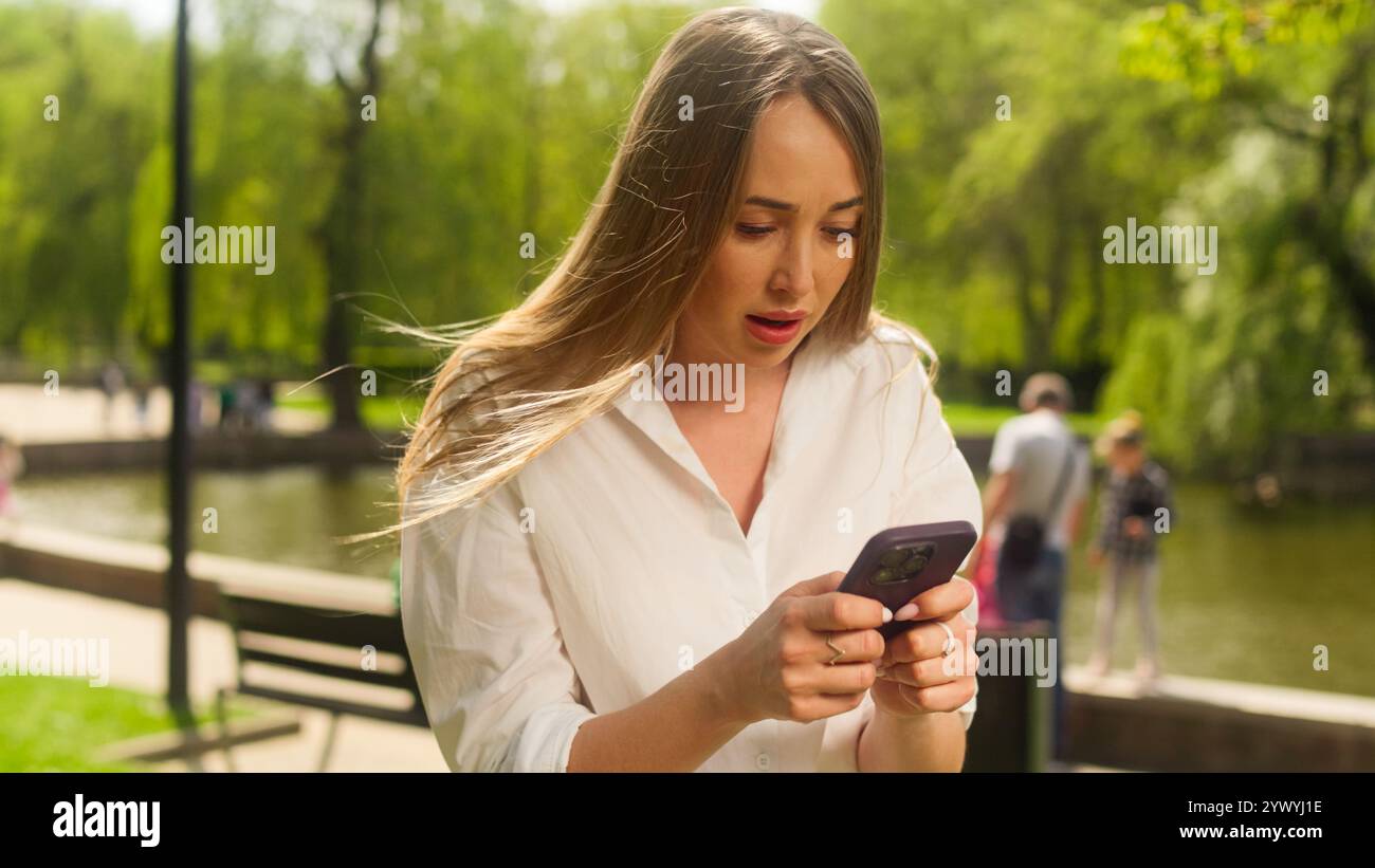 Happy woman holding mobile phone smartphone technology gadget online ...