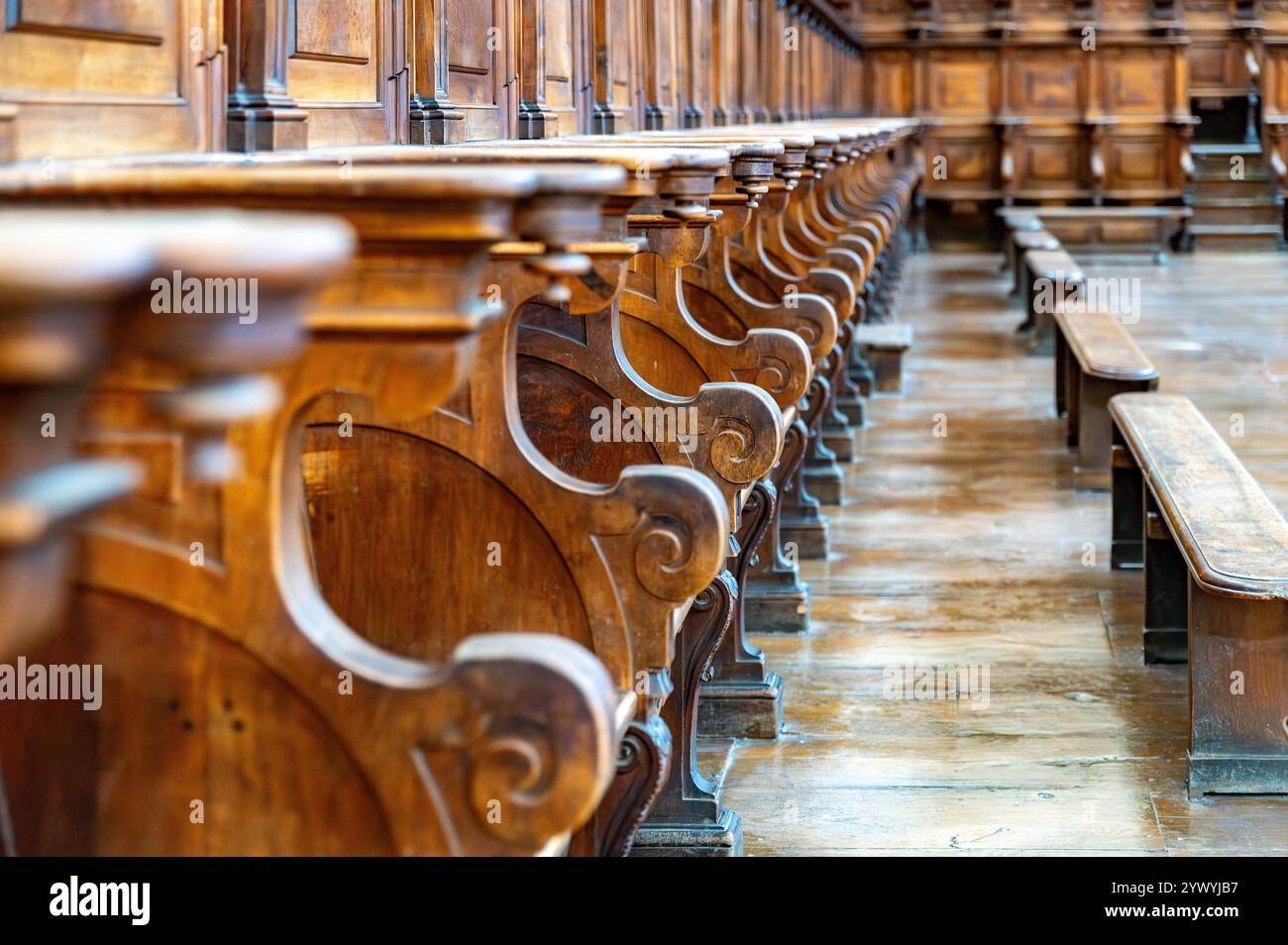 Perspective of the wooden chairs of a cloister in a monastery Stock ...