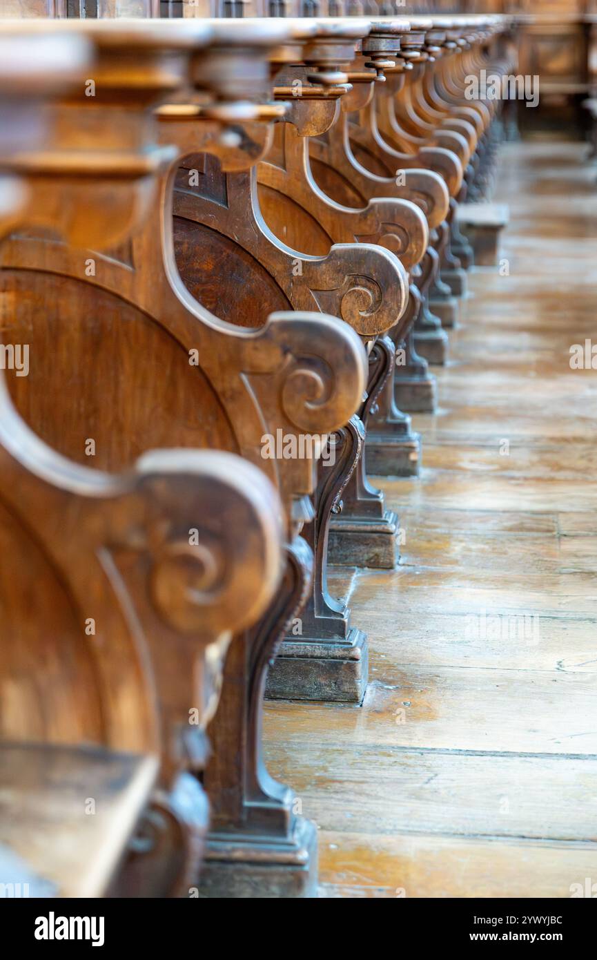Perspective of the wooden chairs of a cloister in a monastery Stock ...