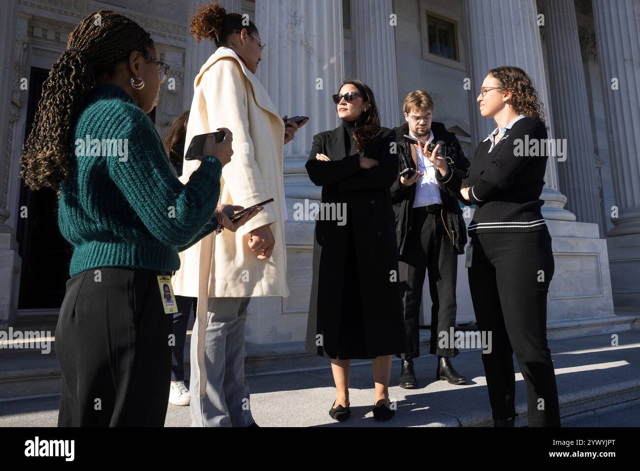 Rep. Alexandria Ocasio-Cortez (D-N.Y.) speaks with reporters as she ...