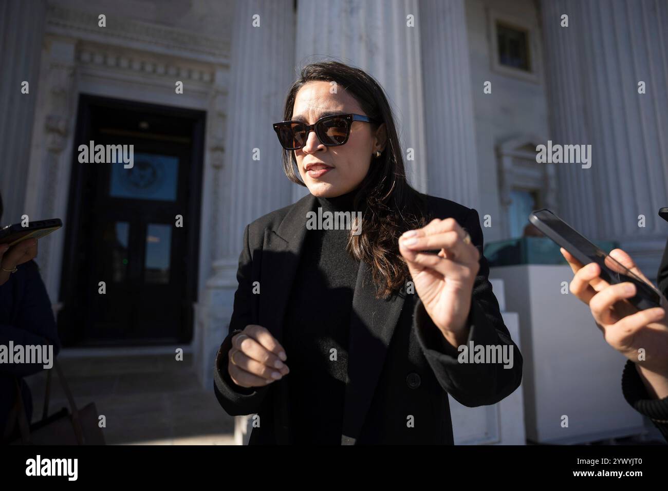 Rep. Alexandria Ocasio-Cortez (D-N.Y.) speaks with reporters as she ...