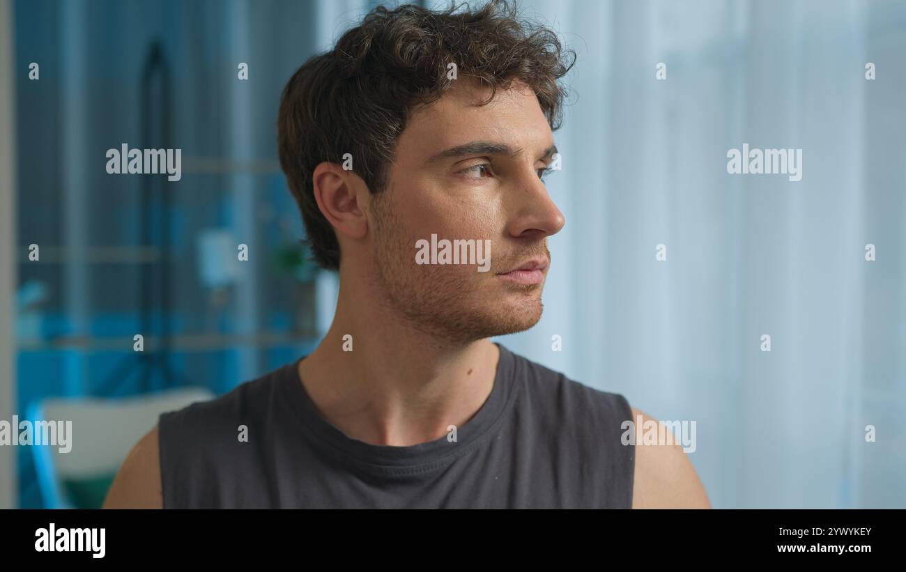Serious Caucasian man turn head looking at camera confident sportsman ...