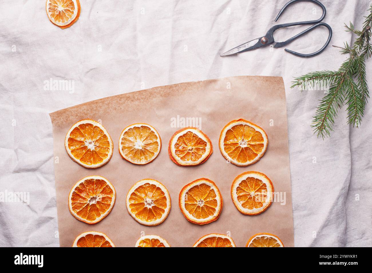 Delicious dried orange on baking sheet and white linen Christmas ...