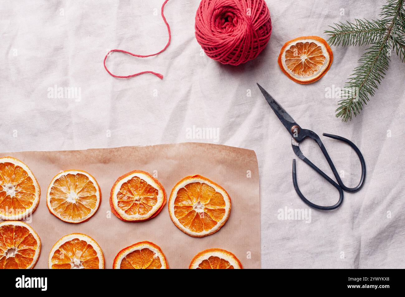 Delicious dried orange on baking sheet and white linen Christmas ...