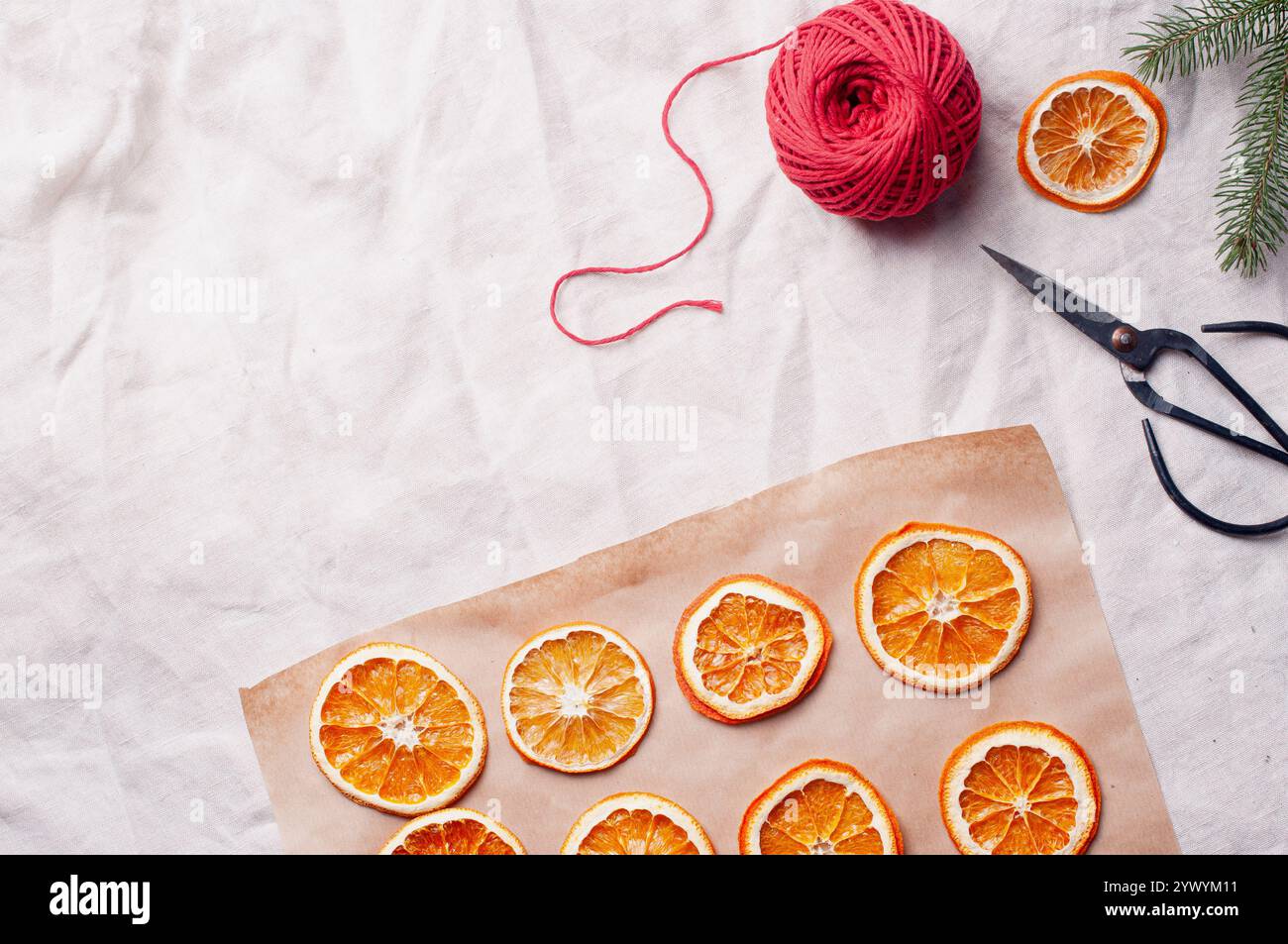 Delicious dried orange on baking sheet and white linen Christmas ...