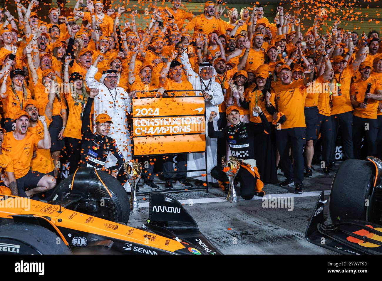 Oscar Piastri, Lando Norris and Zak Brown of McLaren celebrate with the team winning ...