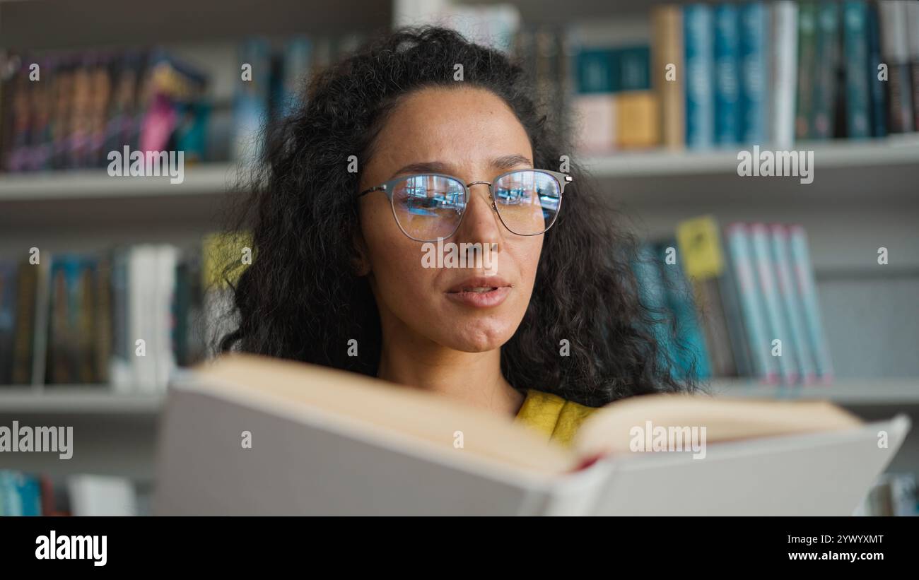 Latino Arabian woman read book textbook novel detective story volume library intellectual girl ...