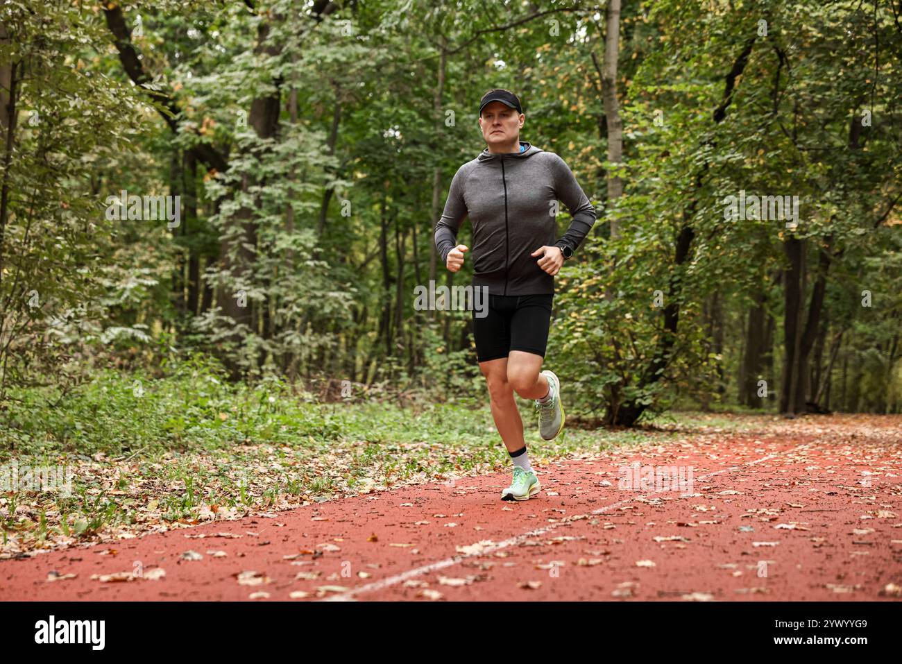 Athletic man running in park hi-res stock photography and images - Alamy