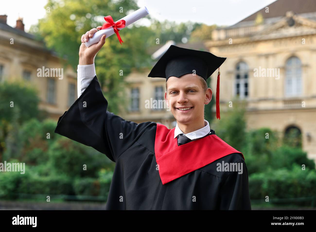 Happy student with diploma after graduation ceremony outdoors Stock ...