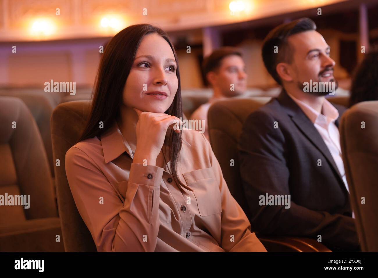 Group of people watching theatrical performance in theatre Stock Photo ...