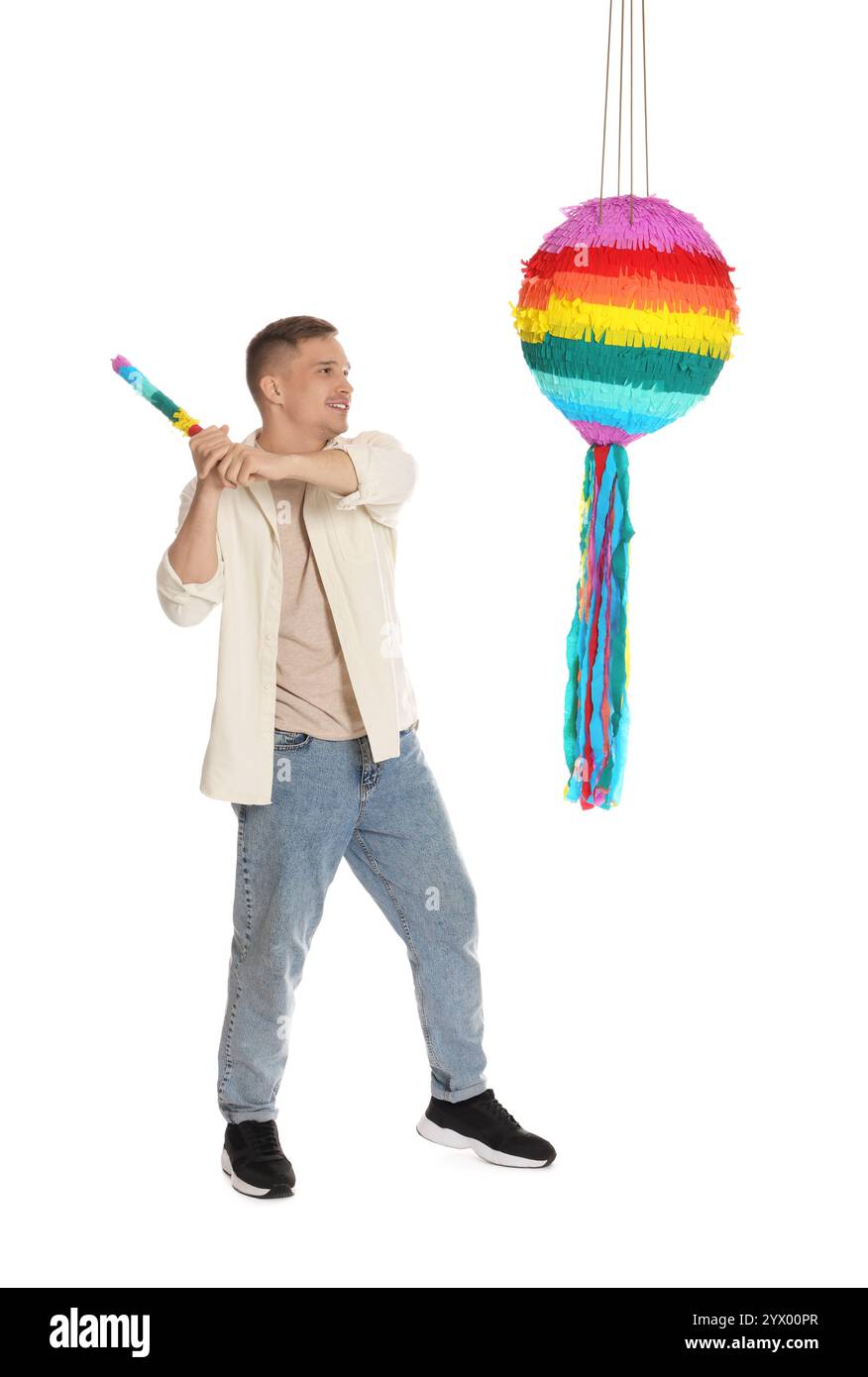 Happy man breaking pinata on white background Stock Photo - Alamy