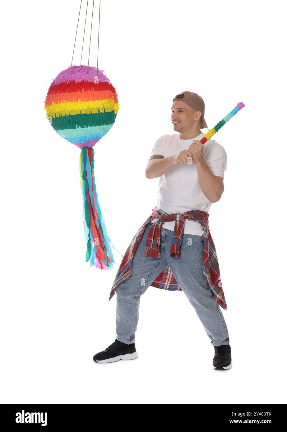 Happy man breaking pinata on white background Stock Photo - Alamy