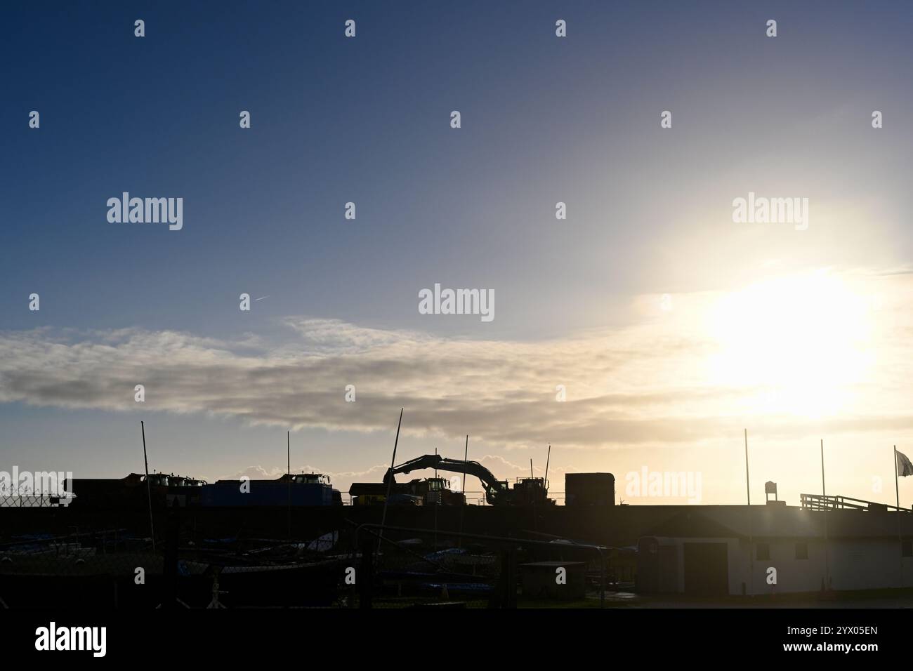 silhouette of rock trucks and loader Stock Photo - Alamy