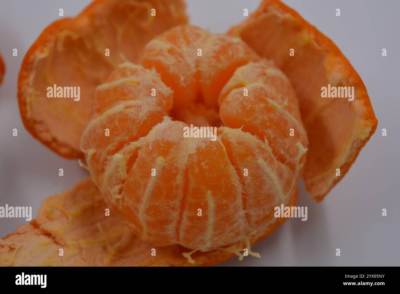 Healthy, wholesome food, fruits. Small slices of orange tangerine are ...