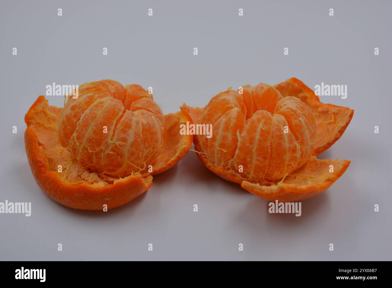 Healthy, wholesome food, fruits. Small slices of orange tangerine are ...